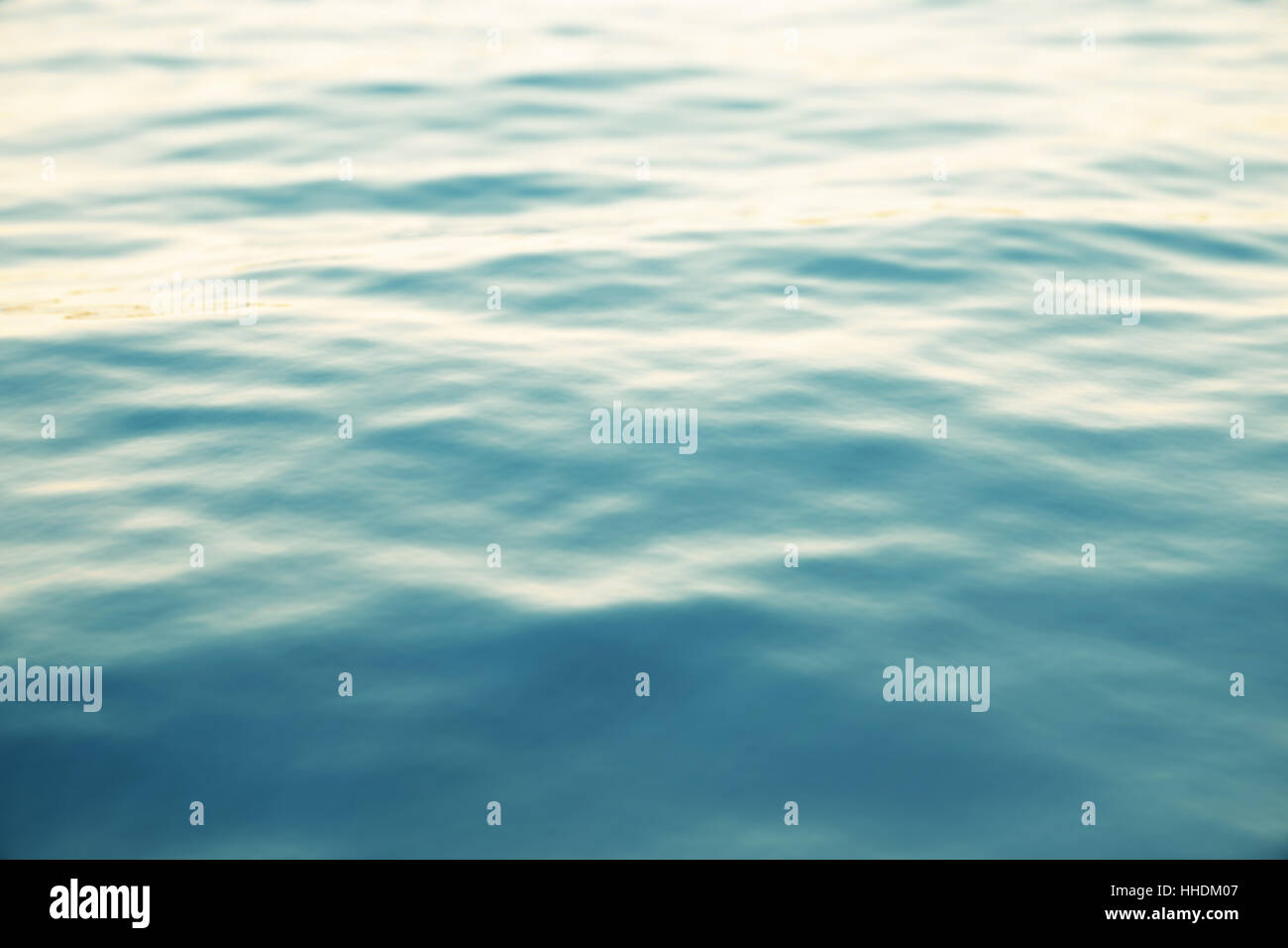 Blue water background with ripples, sea, ocean wave low angle view ...