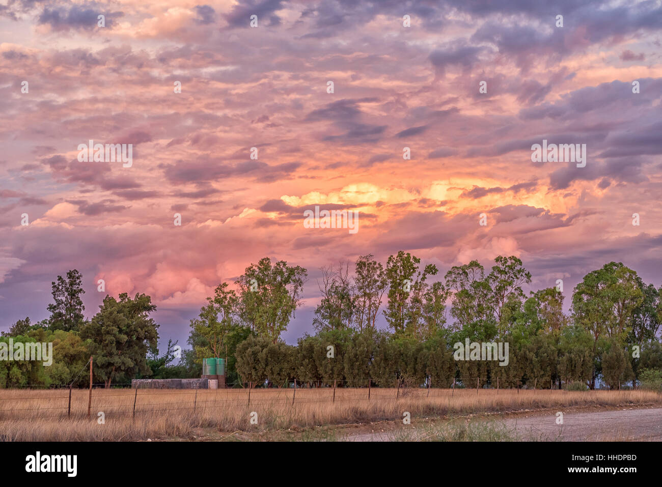 A sunset scene on a farm near Ritchie in the Northern Cape Province of ...