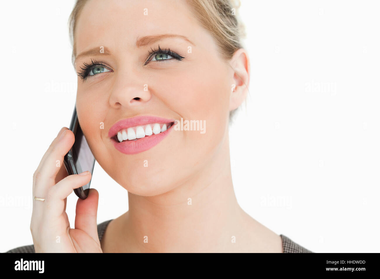 Woman calling with a cellphone against white background Stock Photo - Alamy