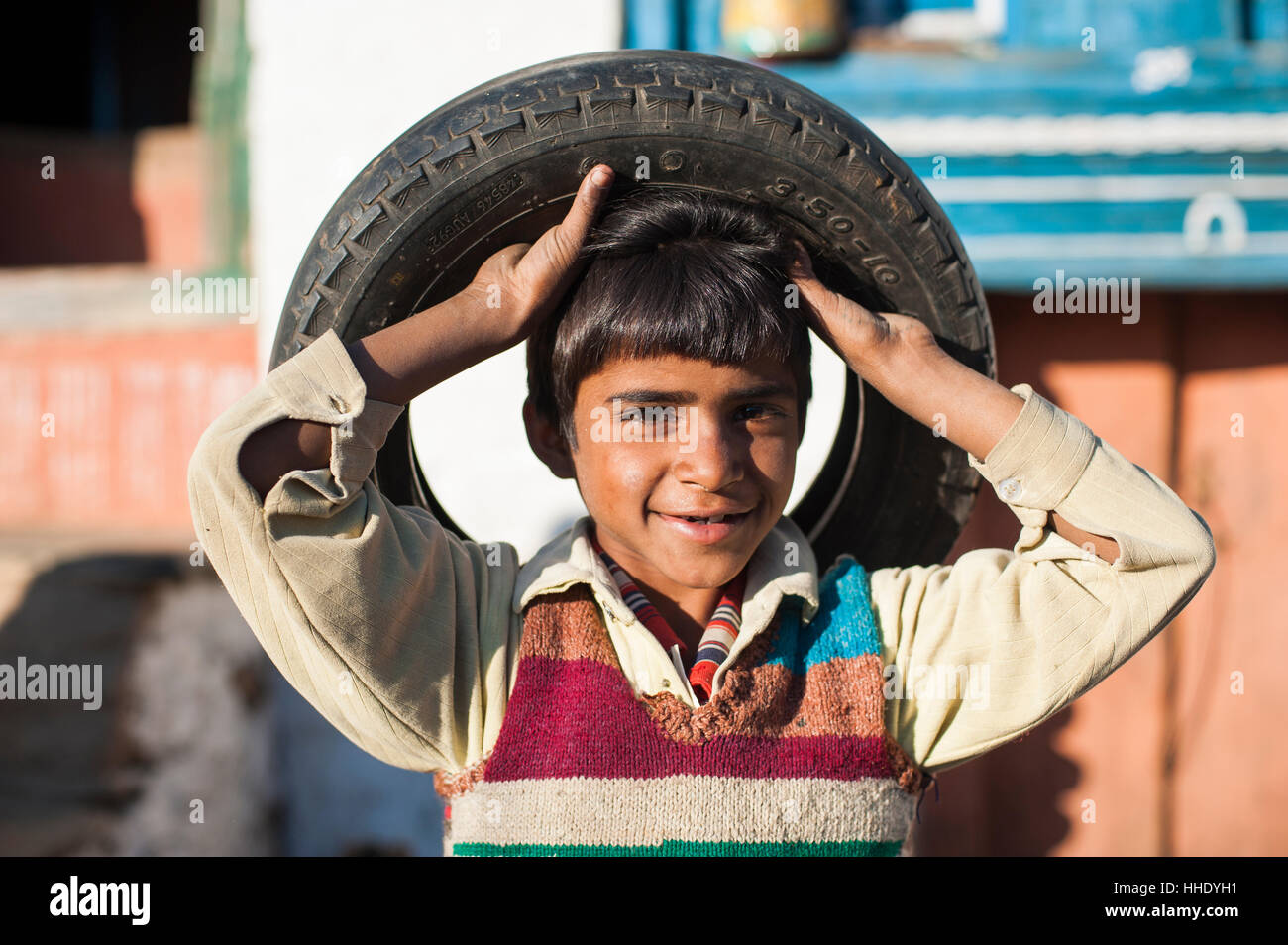 Children in India often utilise discarded wheels and turn them into ...