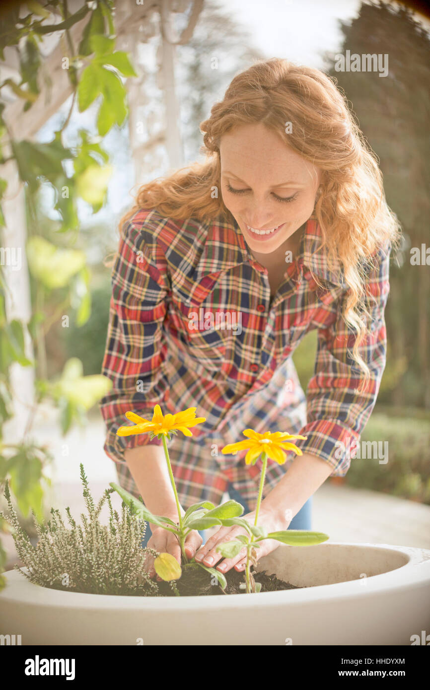 Woman planting flowers hi-res stock photography and images - Alamy