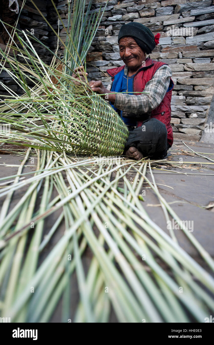A man uses great skill and traditional knowledge to make a bamboo ...