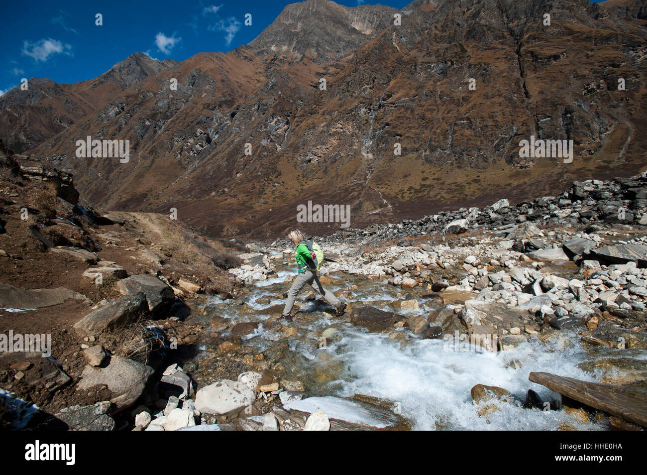 Stepping stones and stream on the trail in the Kagmara Valley, a less ...