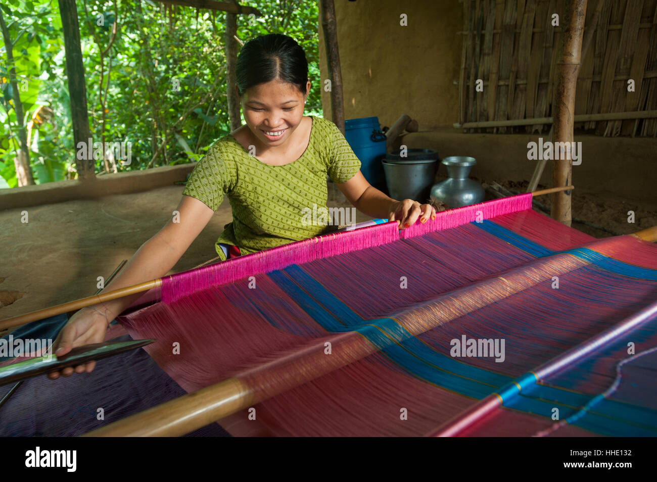 A woman weaves traditional clothes using a hand loom, Chittagong Hill ...