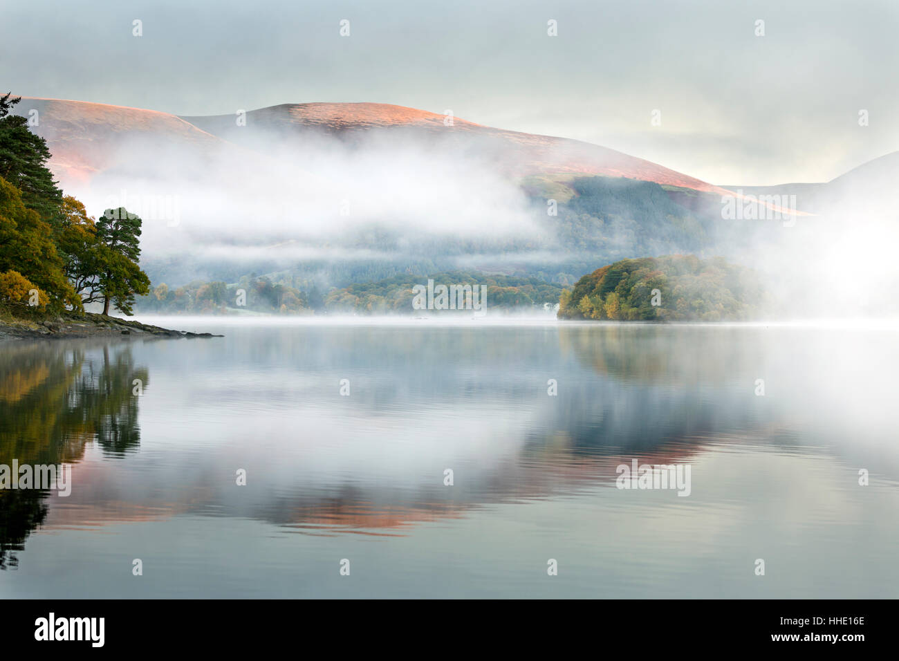 Mist over Derwent Water at dawn, from Brandlehow, Borrowdale, The Lake ...