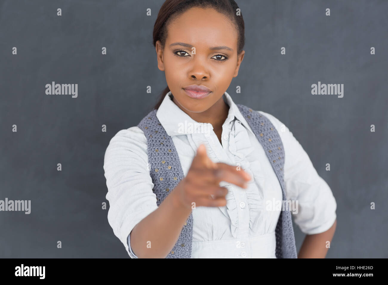 Serious teacher pointing finger in hi-res stock photography and images ...
