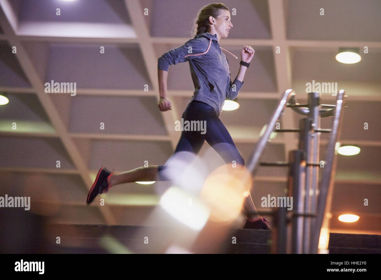 Female runner running above stairs Stock Photo - Alamy