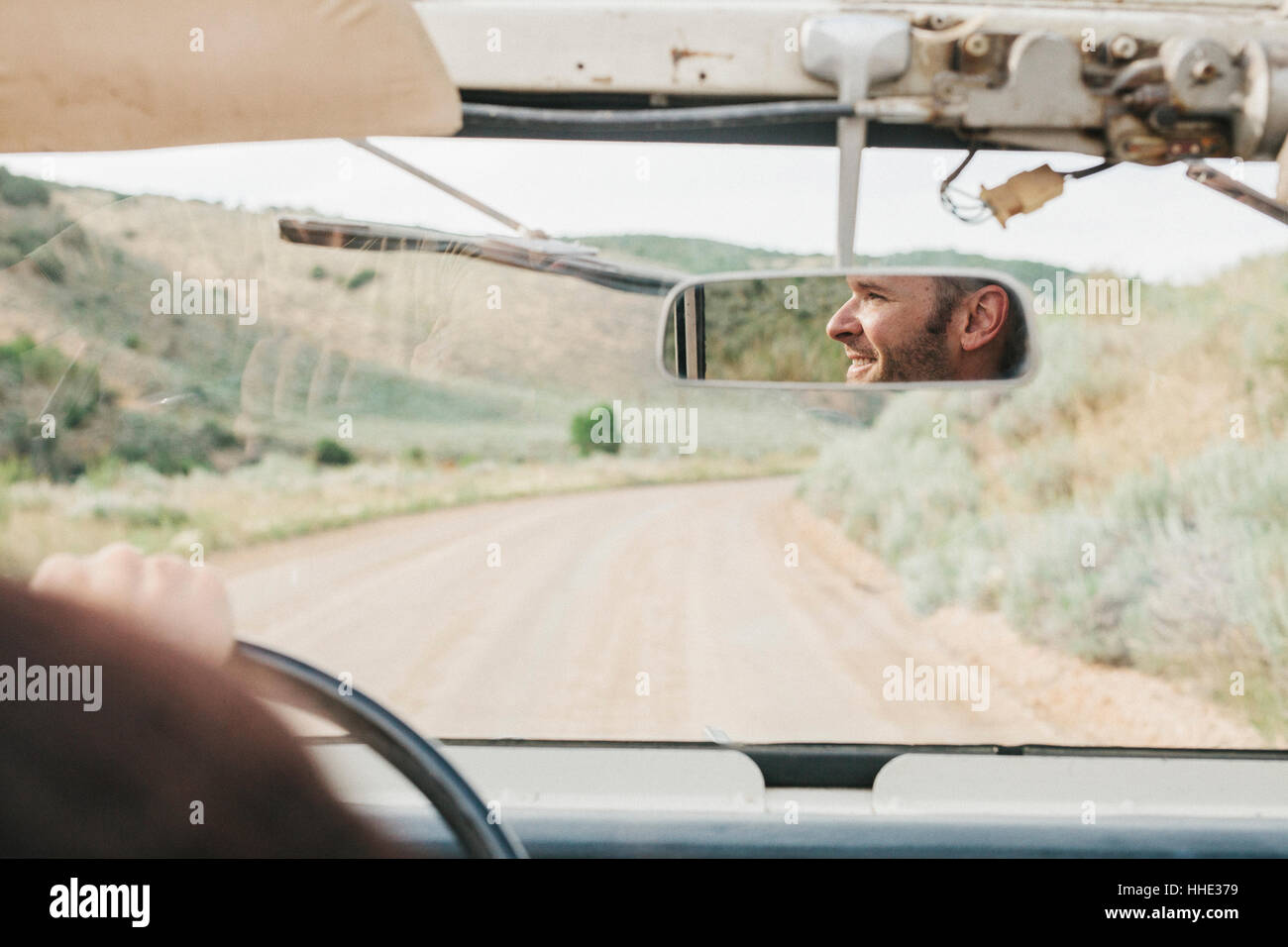 View through the windscreen of an open top jeep. Reflection of the ...