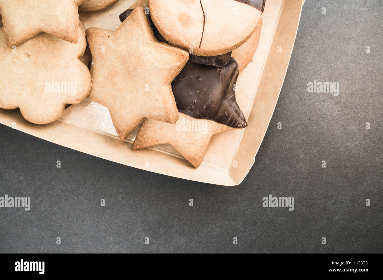 hand made vegan biscuits in a paper tray - stone worktop Stock Photo ...