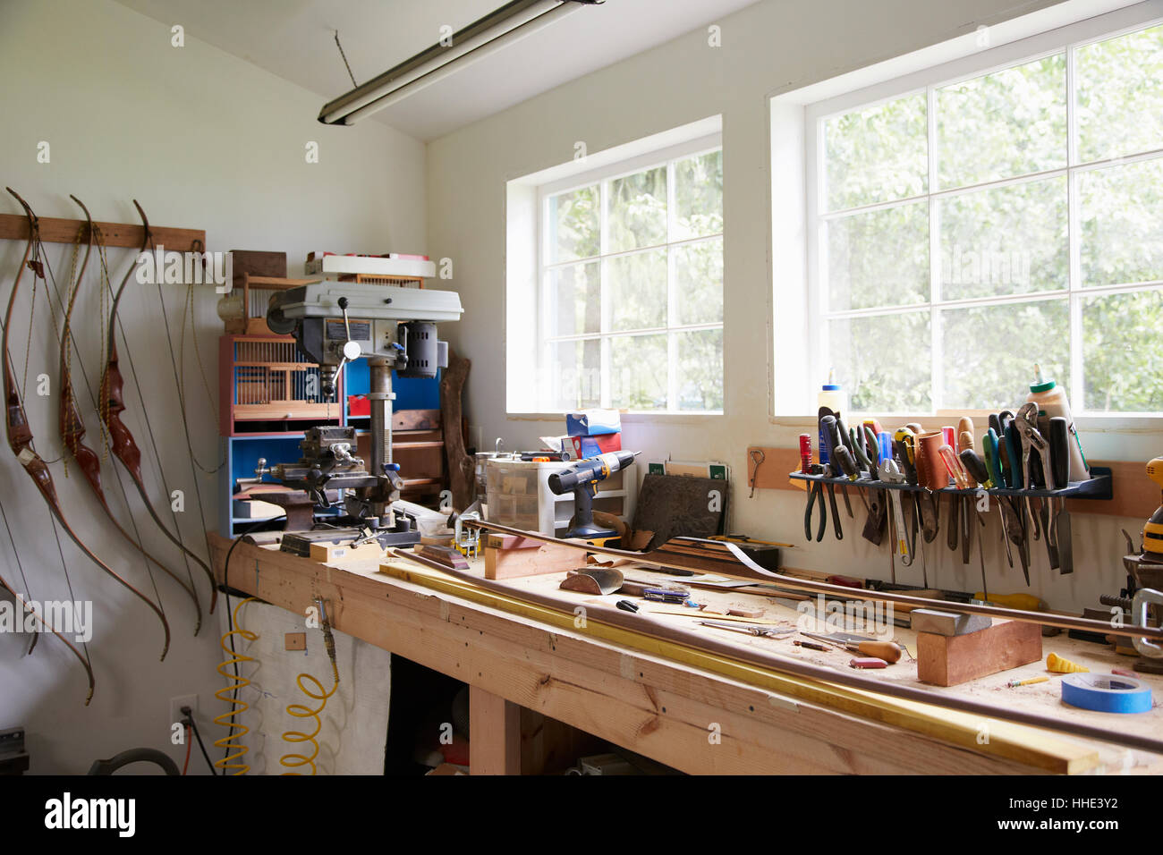 A workshop bench with components and tools, and finished articulated ...