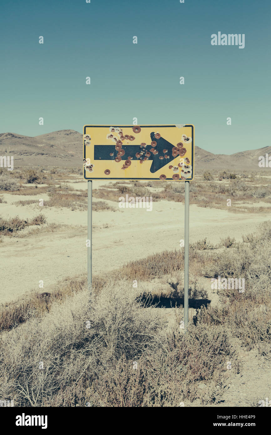 Bullet riddled arrow sign in desert, Black Rock Desert, Nevada Stock ...