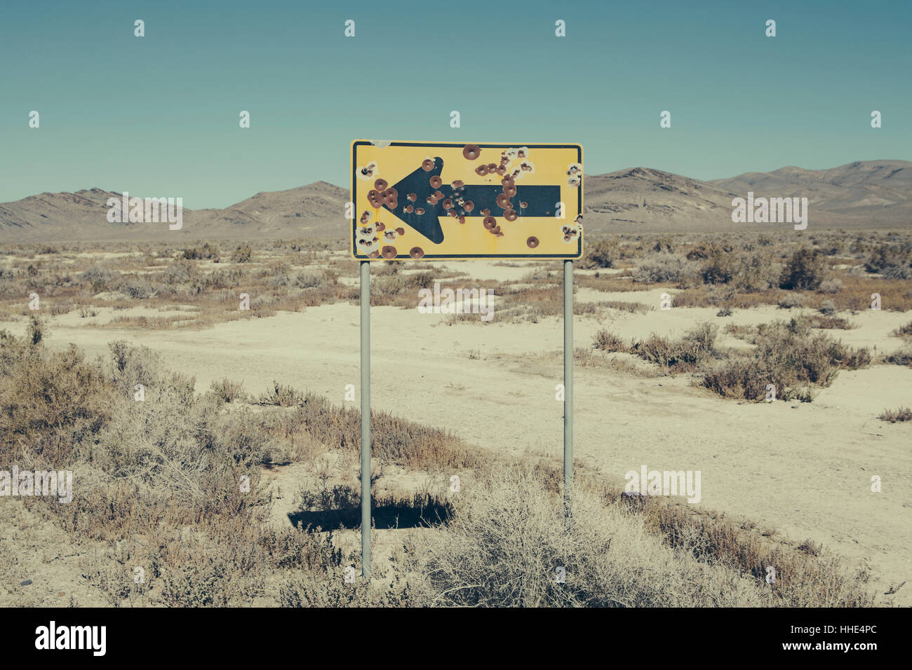 Bullet riddled arrow sign in desert, Black Rock Desert, Nevada Stock ...