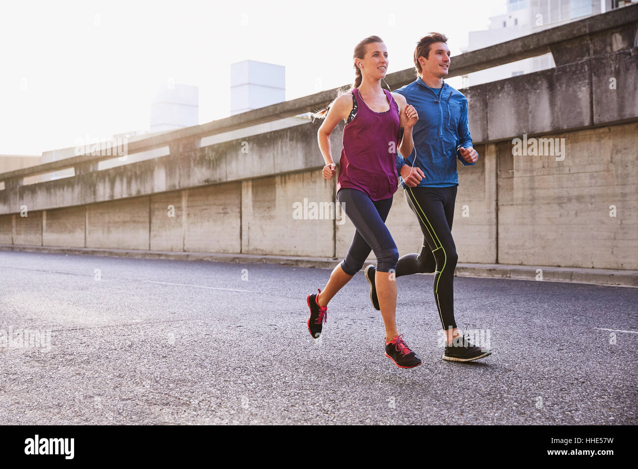 Happy couple runner road hi-res stock photography and images - Alamy