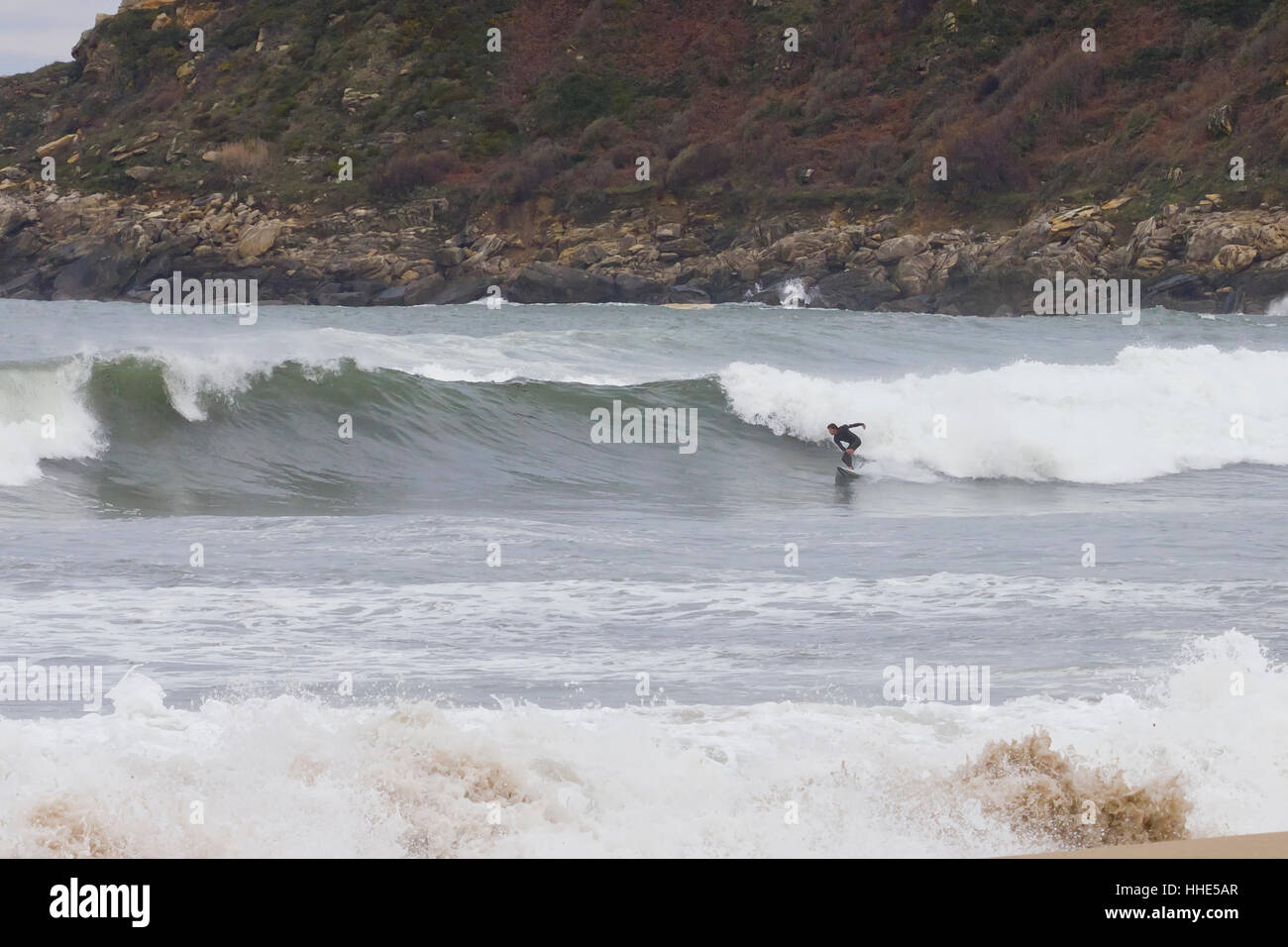 Surfing big waves Stock Photo - Alamy