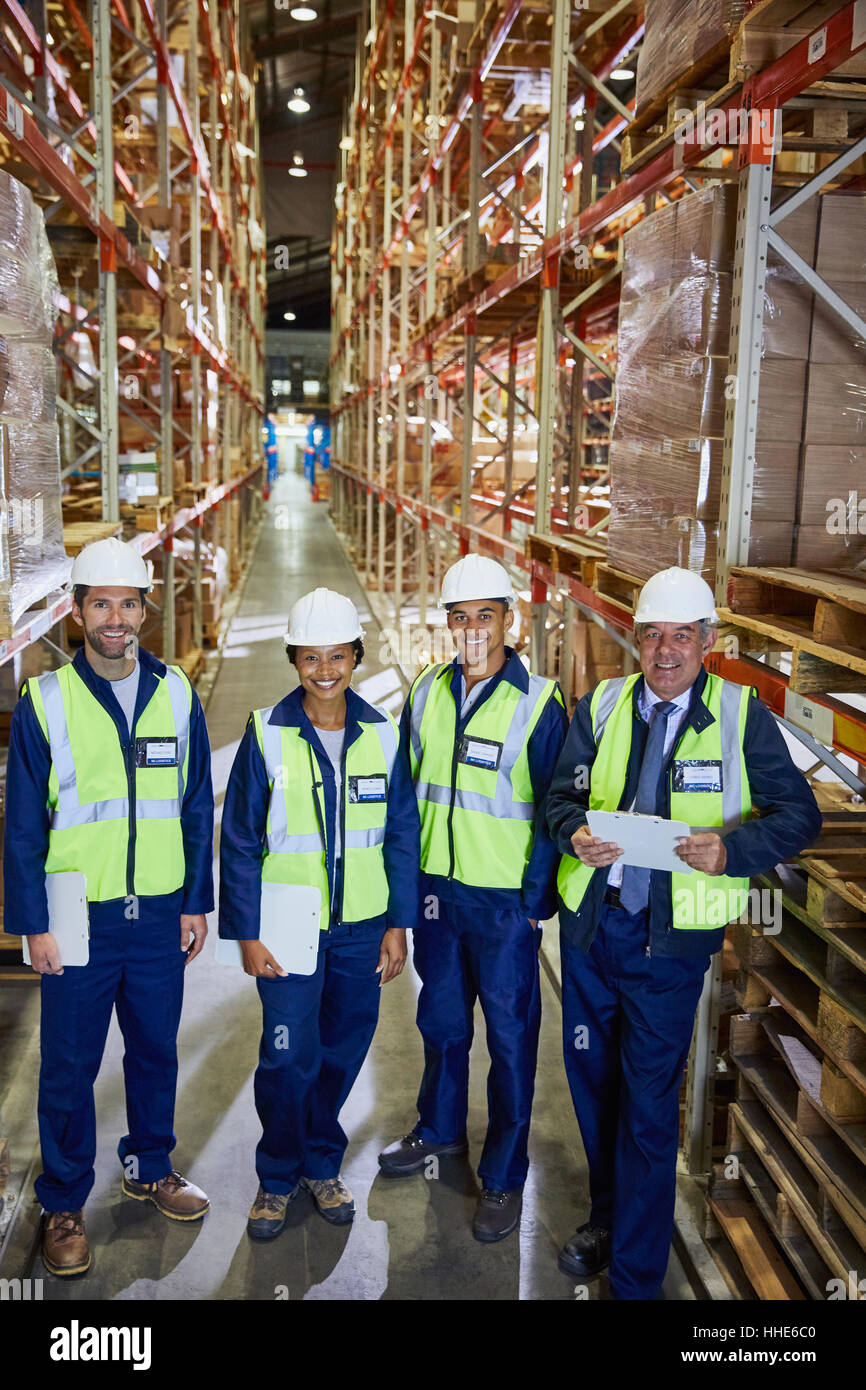 Portrait smiling workers in distribution warehouse Stock Photo - Alamy