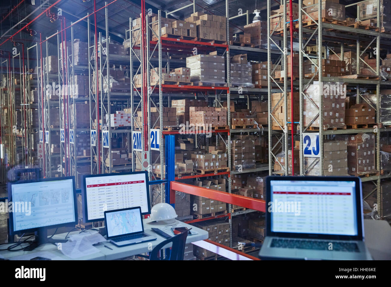 Laptops and computers in distribution warehouse Stock Photo - Alamy