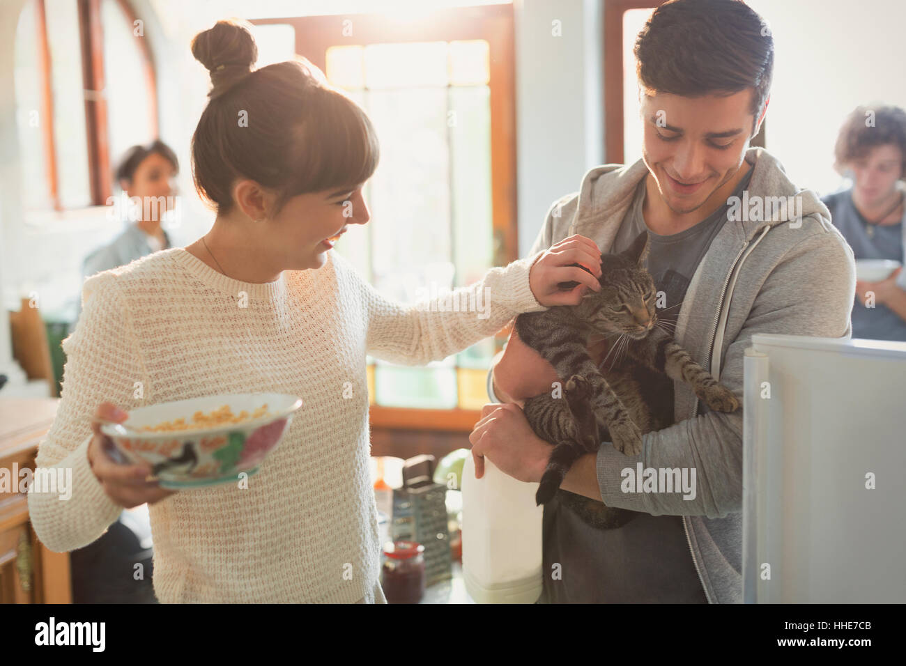 Young woman watching cat hi-res stock photography and images - Alamy
