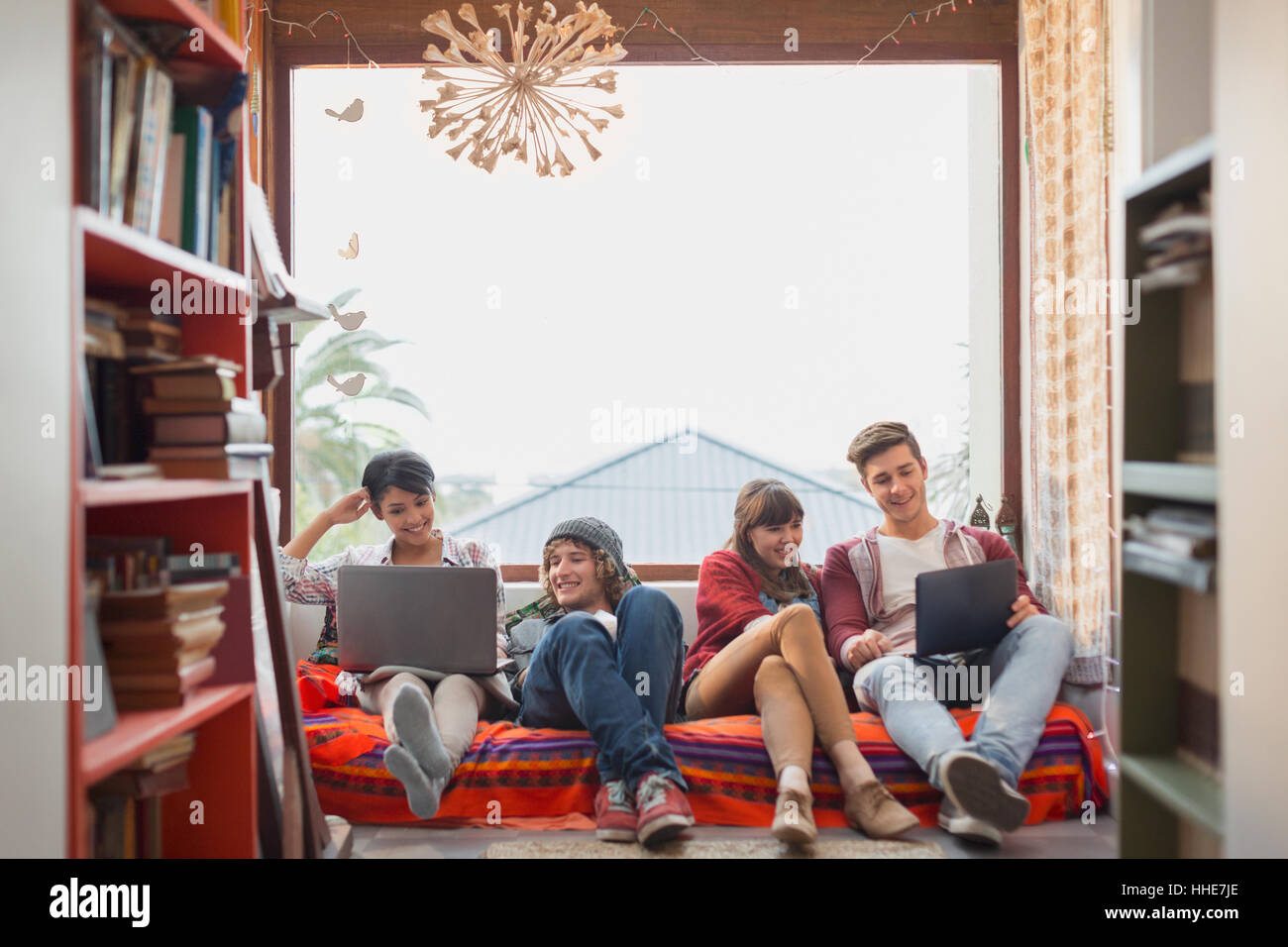 Young couples college students studying using laptop and digital tablet ...