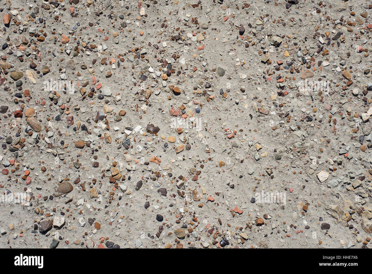 Rocks Embedded in Dirt forming a background or texture Stock Photo - Alamy