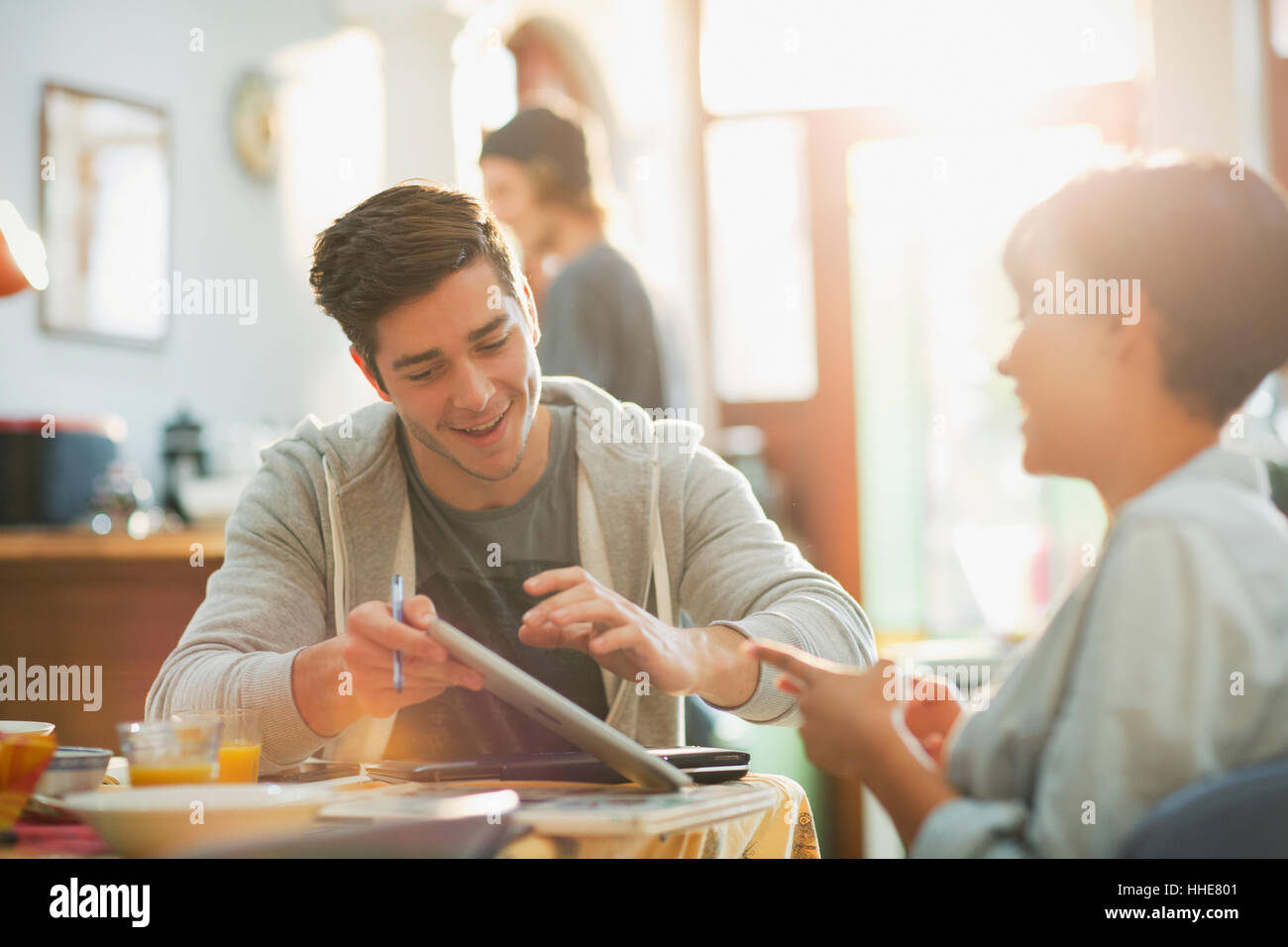 Young couple college students studying using digital tablet Stock Photo ...