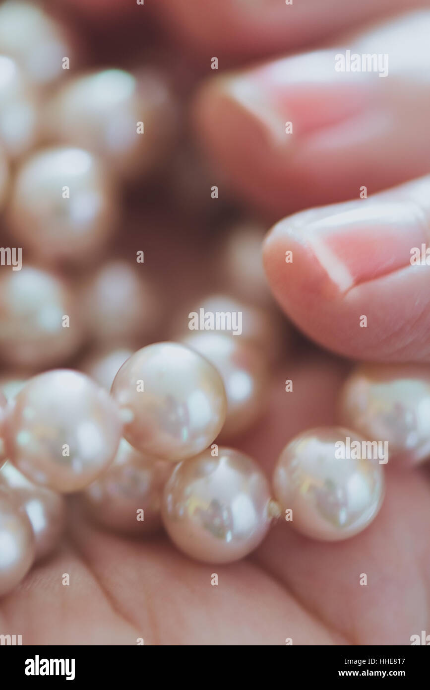 Pearls in hand hi-res stock photography and images - Alamy