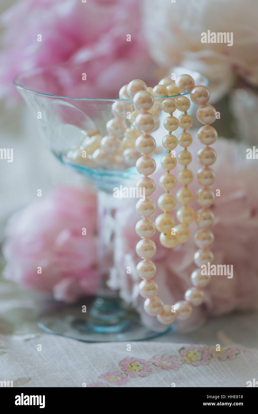 Pearls in a vintage champagne glass Stock Photo - Alamy