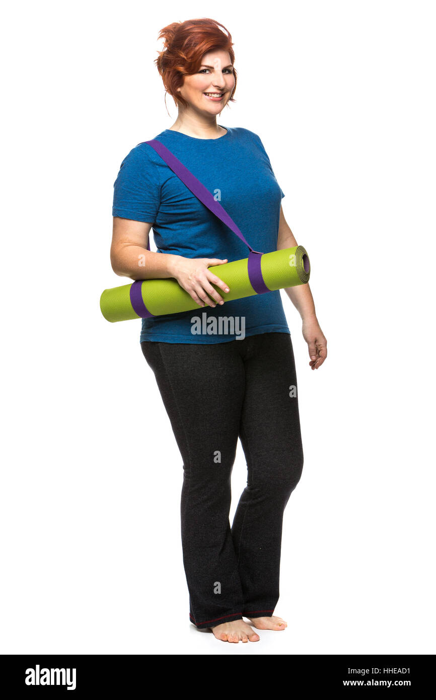 curvy woman carrying yoga mat on the white background Stock Photo - Alamy