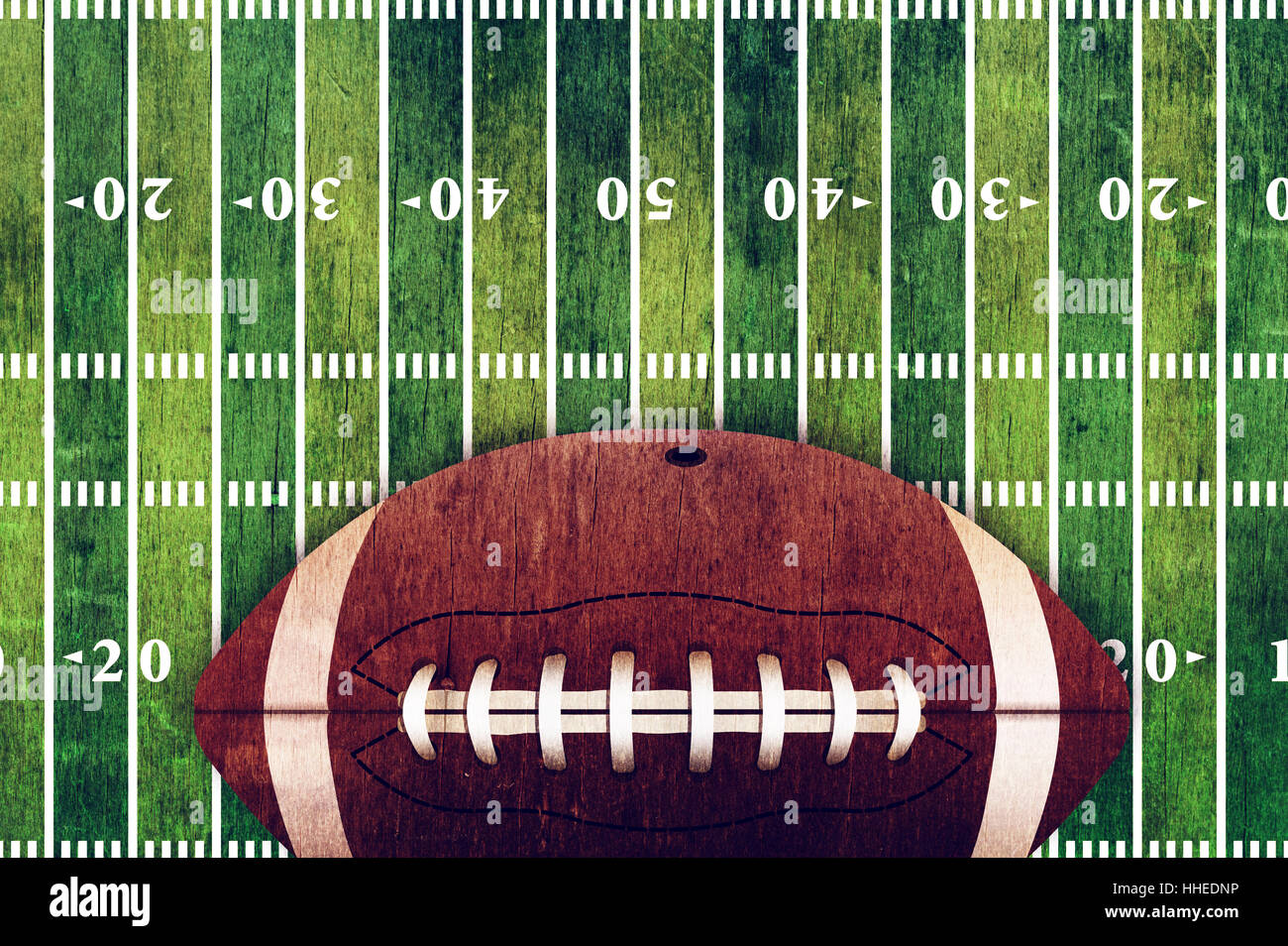 A retro grunge American football field and ball background illustration ...