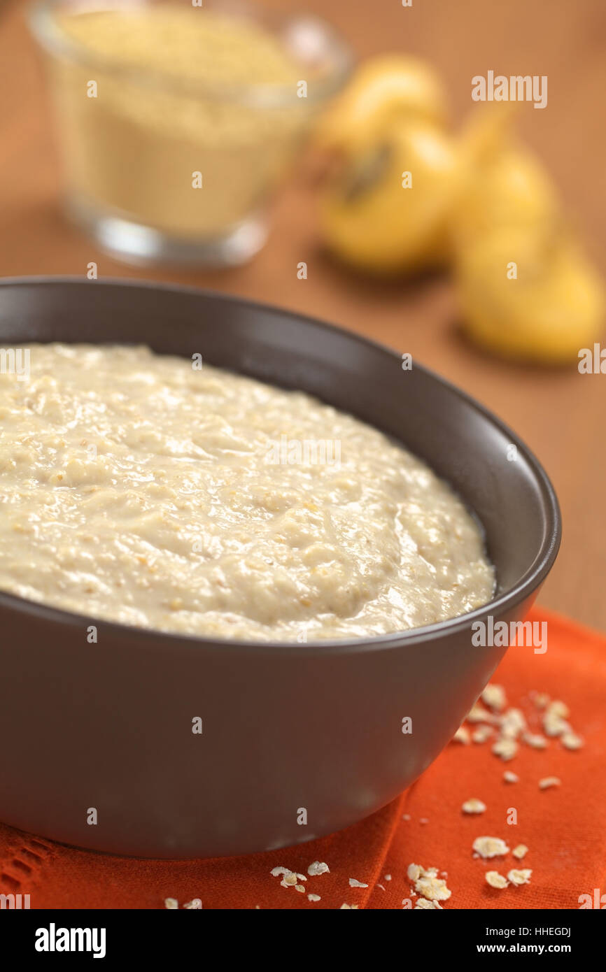 Bowl of cooked oatmeal porridge mixed with powdered maca or Peruvian ...