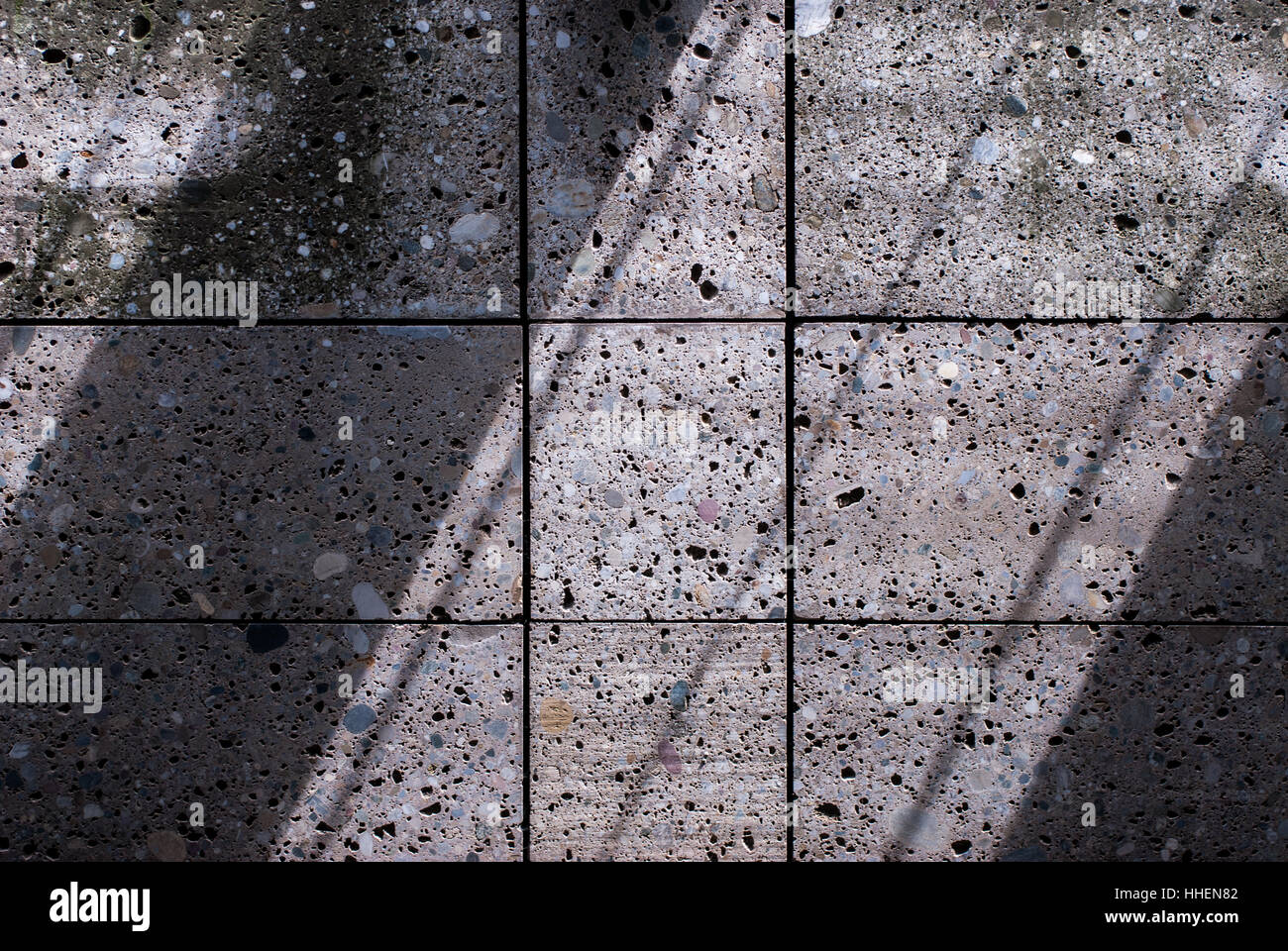 Stone wall with diagonal shadows and a cross Stock Photo - Alamy