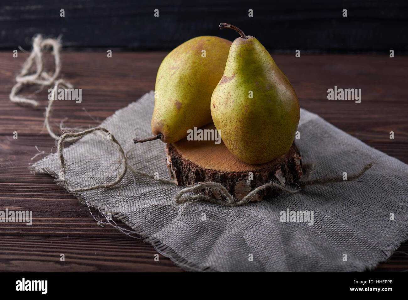 Fresh green pears on a rustic background Stock Photo - Alamy