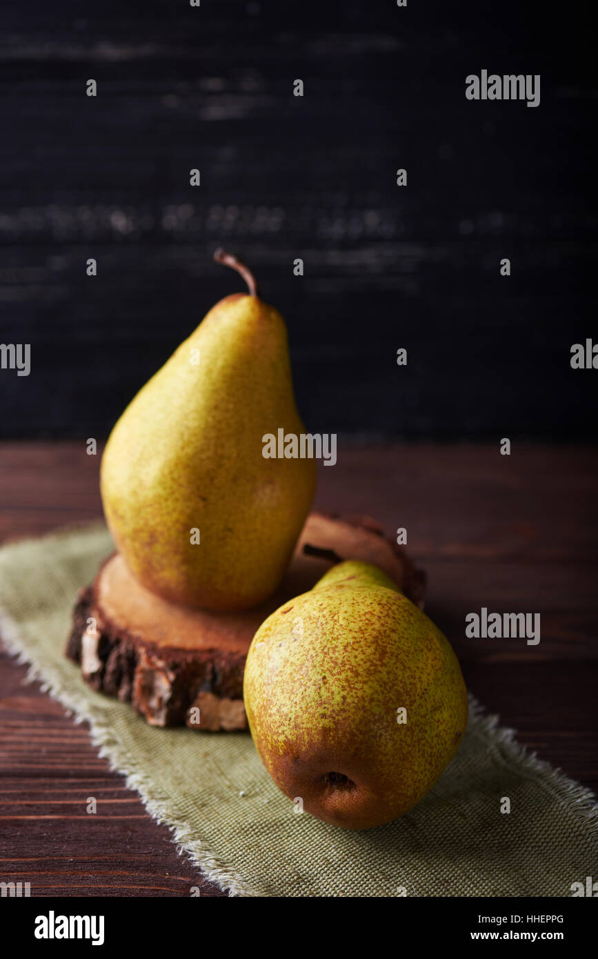 Fresh green pears on a rustic background Stock Photo - Alamy