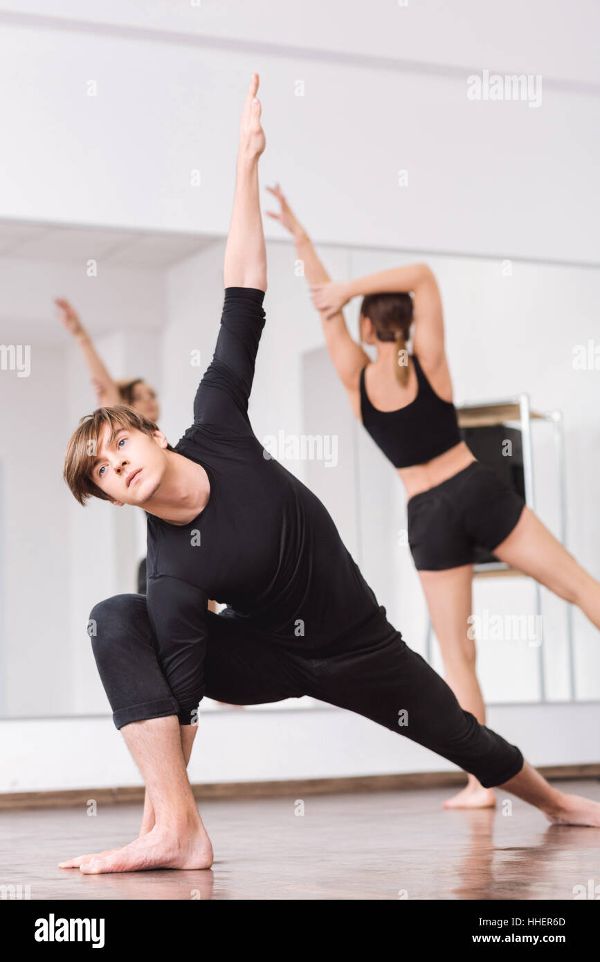 Nice good looking man focusing on the physical exercise Stock Photo - Alamy