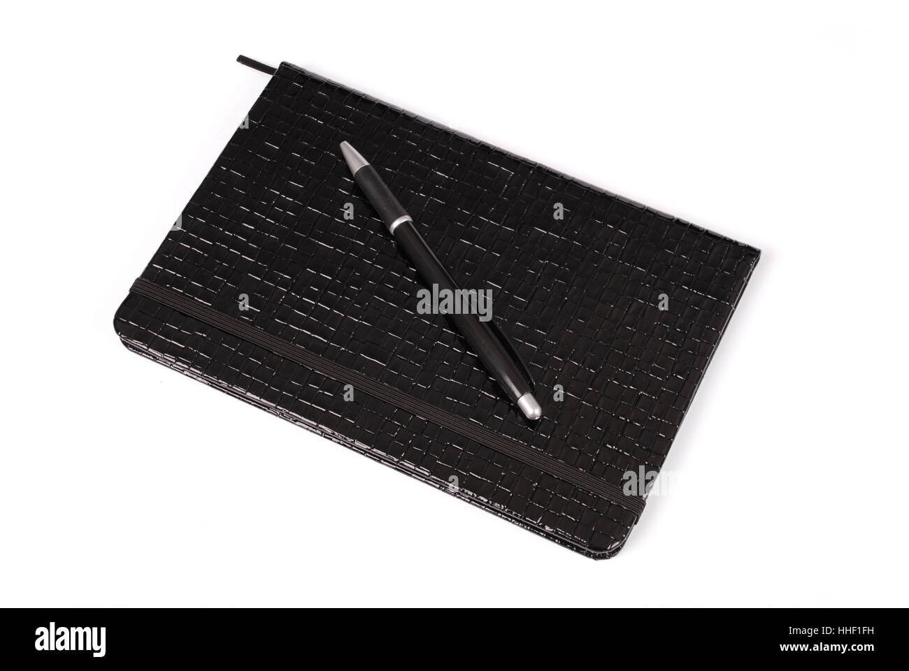 Black notebook with the black handle facing right angle to us isolated ...