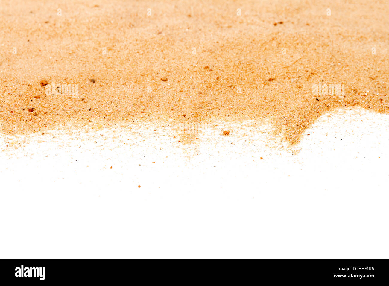 Pile of yellow sand isolated on white background Stock Photo - Alamy