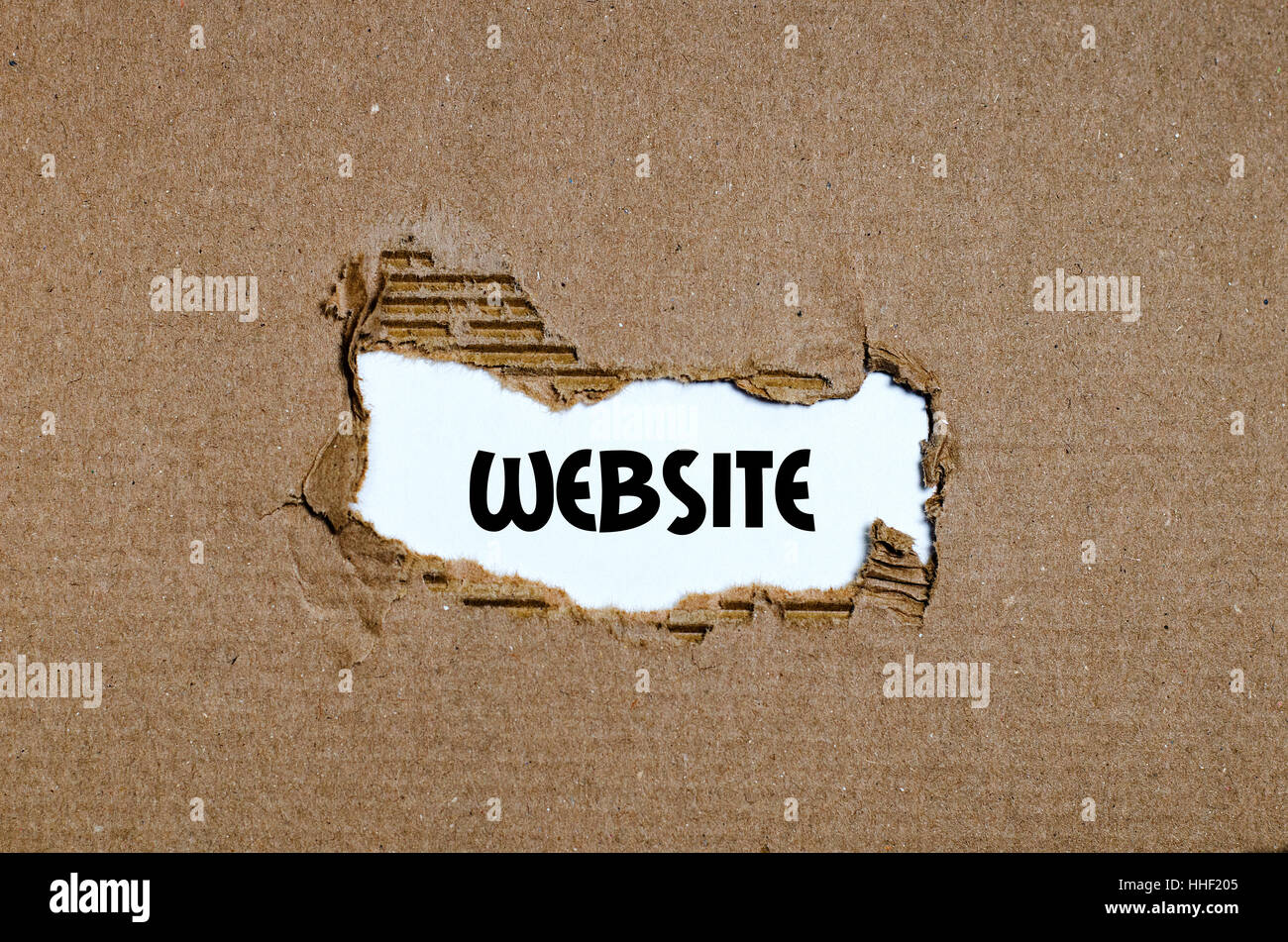 The word website appearing behind torn paper Stock Photo - Alamy