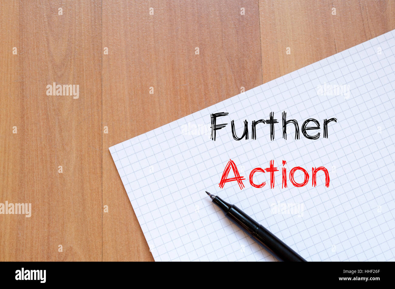 Further action text concept write on notebook Stock Photo - Alamy