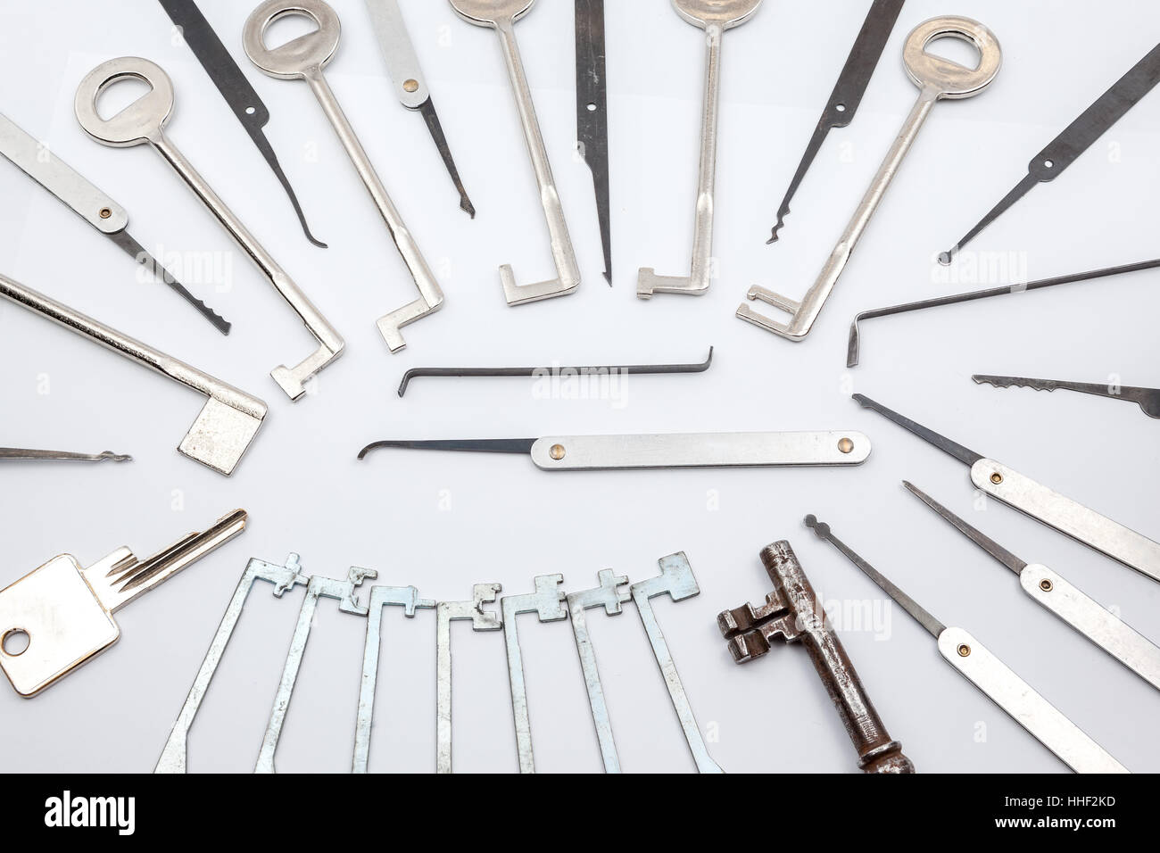 several lockpicking to open a lock on a door Stock Photo - Alamy