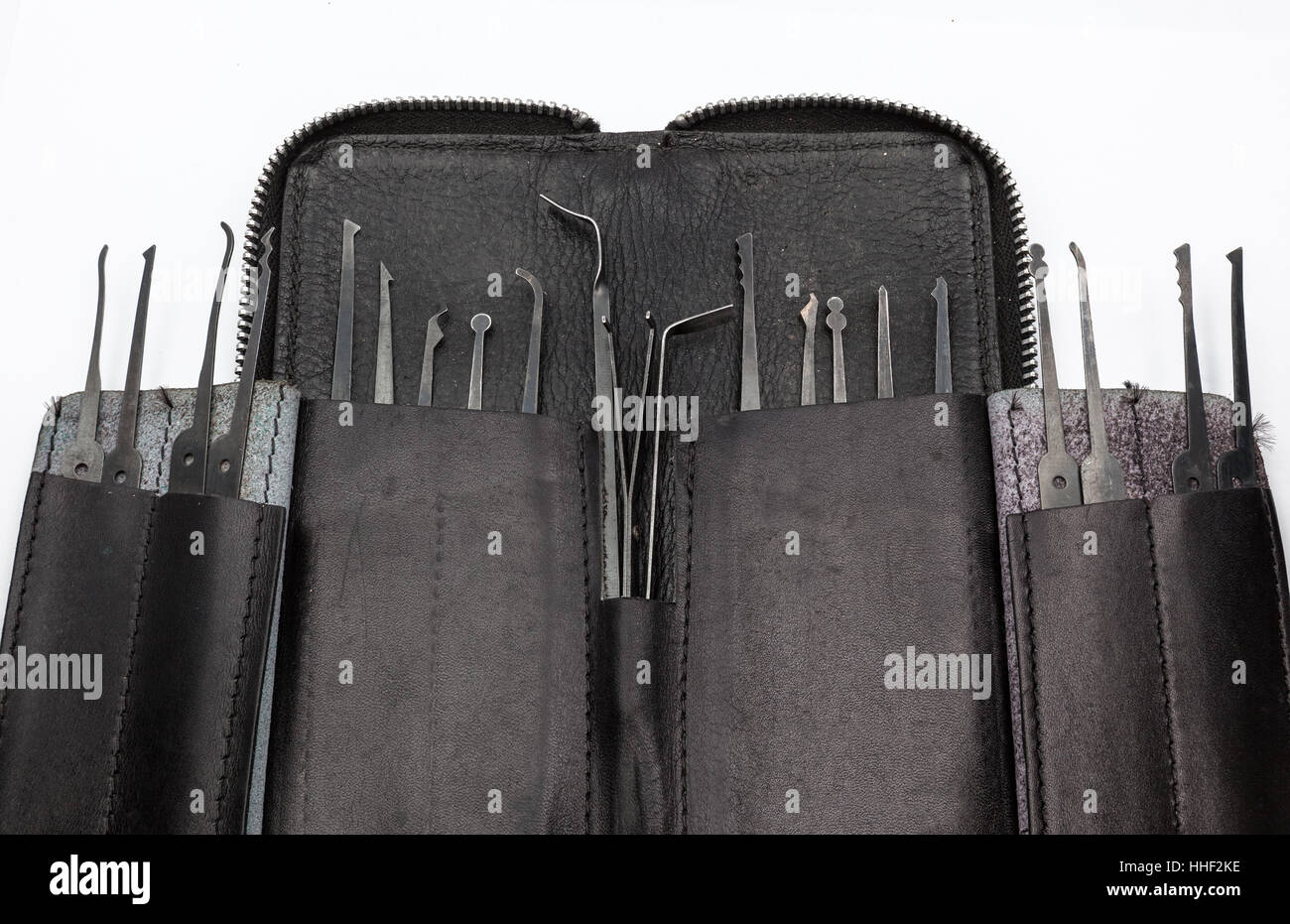 several lockpicking to open a lock on a door Stock Photo - Alamy