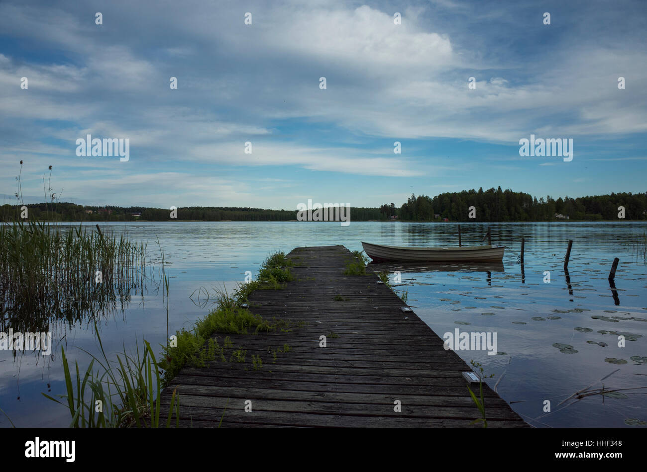 Wood Bridge And Boat At Evening In Sweden Stock Photo - Alamy