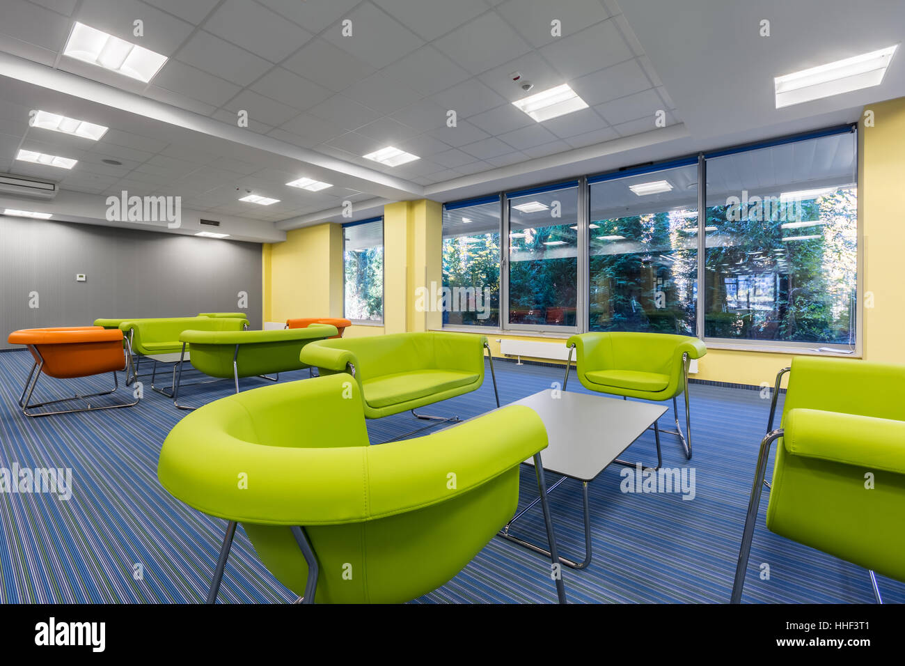 University interior with fluo green lounge set with table Stock Photo ...