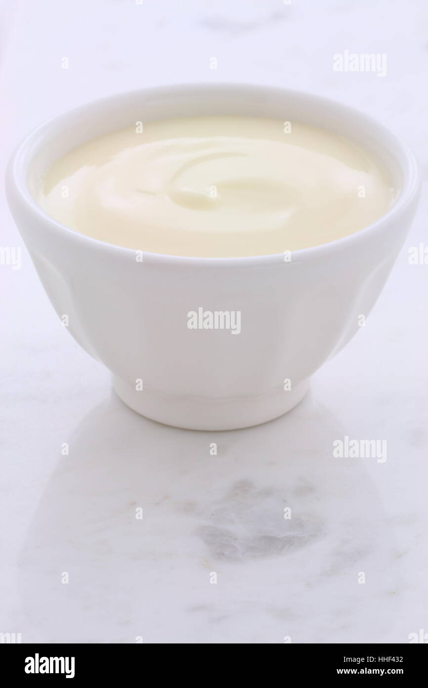 Delicious, nutritious and healthy fresh plain yogurt on vintage carrara ...