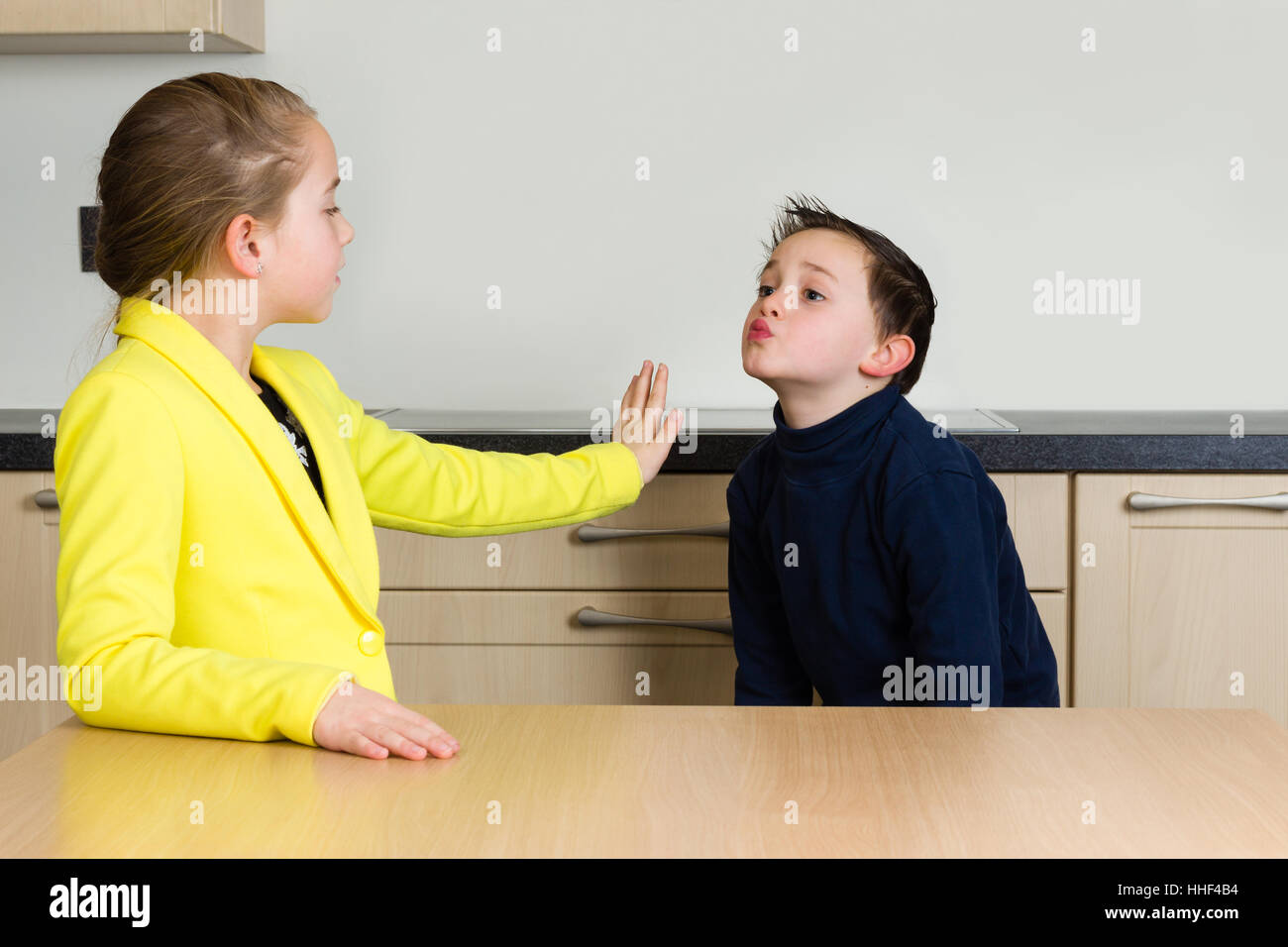 Little pretty girl turns down a cute little boy who is trying to give ...