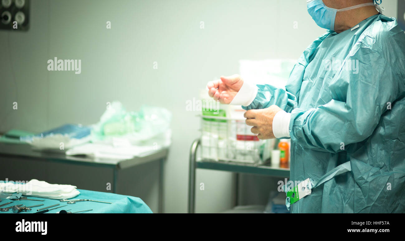 Surgeon in hospital surgery in sterile uniform "scrubs" in operating ...