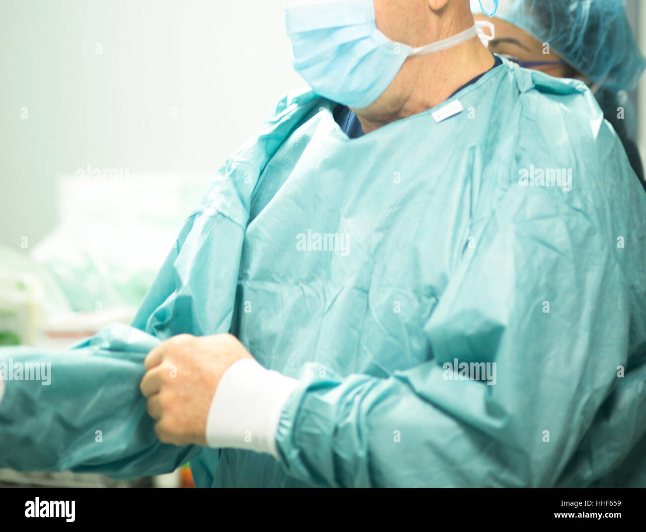 Surgeon in hospital surgery in sterile uniform "scrubs" in operating ...