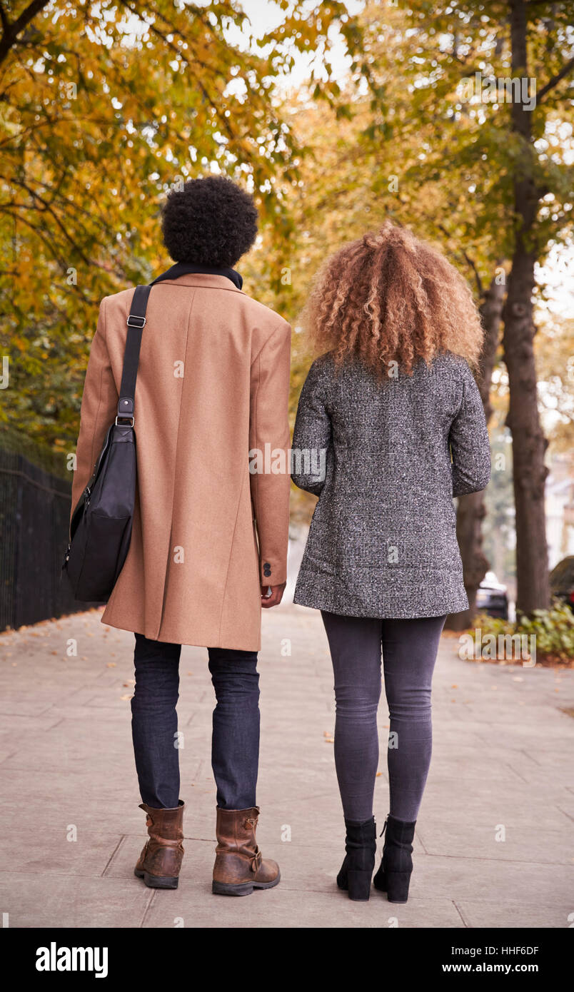 Rear View Of Stylish Couple Walking On Fall Street In City Stock Photo ...
