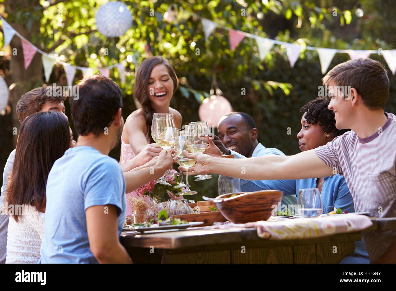 Friends Making A Toast At Outdoor Backyard Party Stock Photo - Alamy