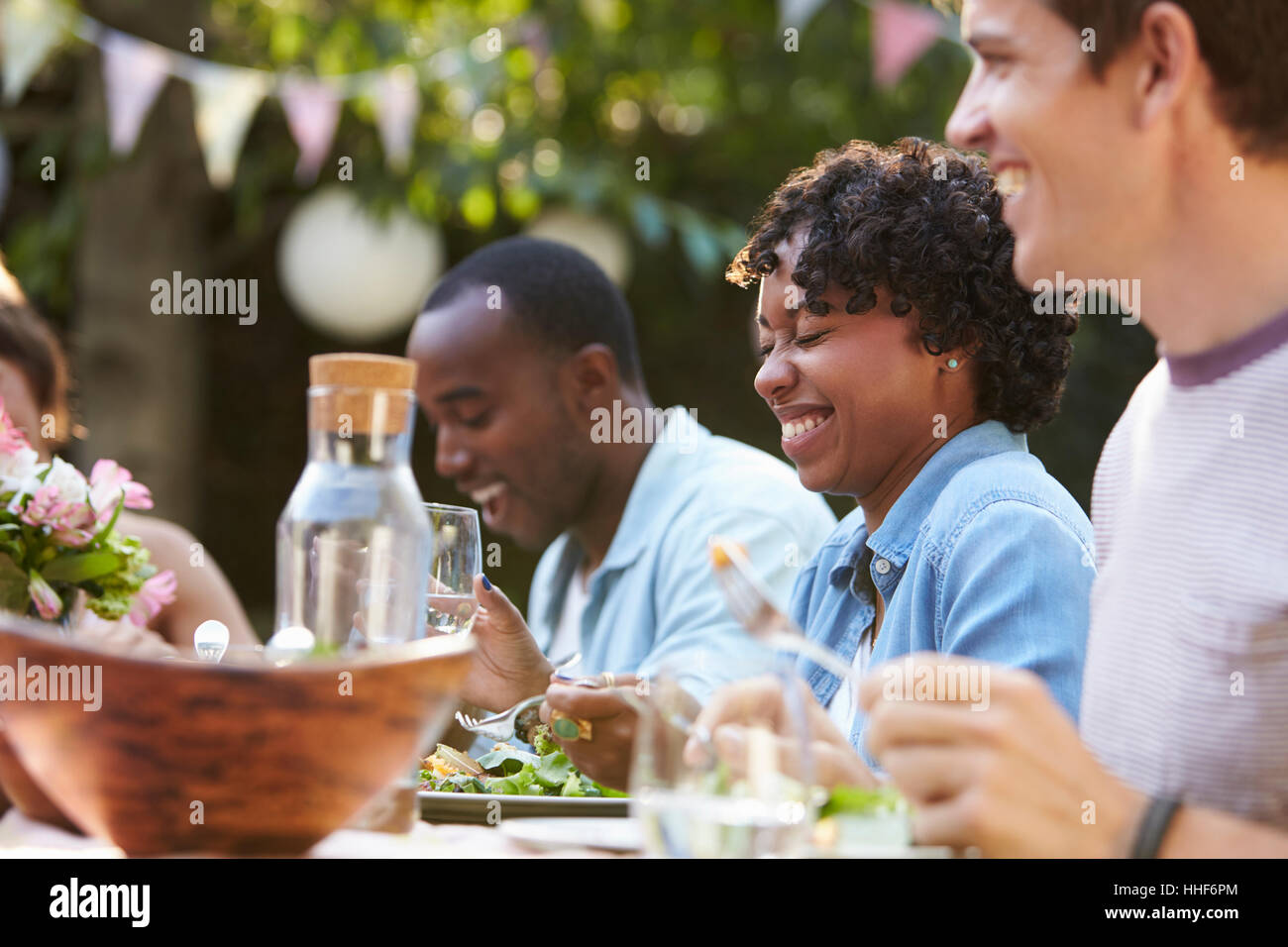 Young Woman Enjoying Outdoor Backyard Party With Friends Stock Photo ...