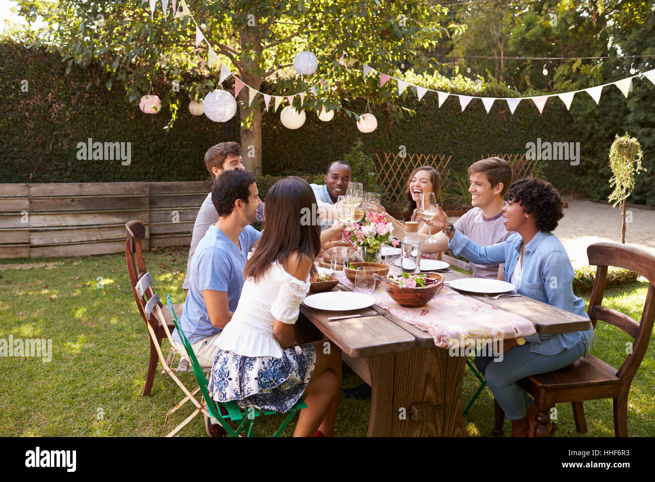 Friends Making A Toast At Outdoor Backyard Party Stock Photo - Alamy