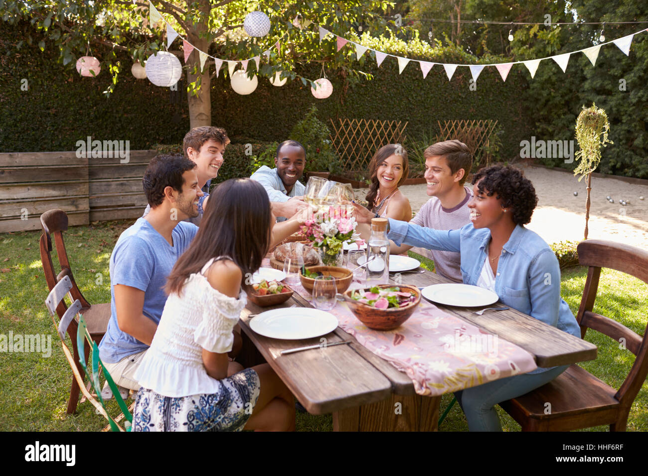Friends Making A Toast At Outdoor Backyard Party Stock Photo - Alamy